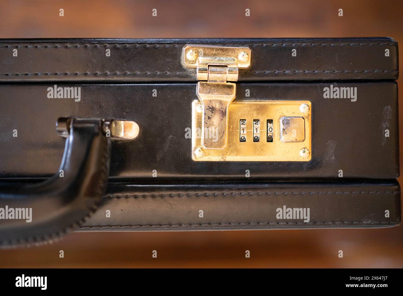 Old briefcase with lock code Stock Photo - Alamy