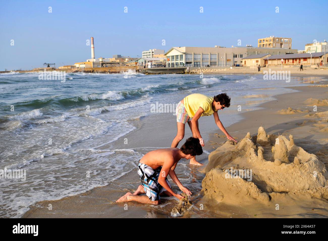 Children building sand castles on the beach in Tel-Aviv, Israel Stock ...