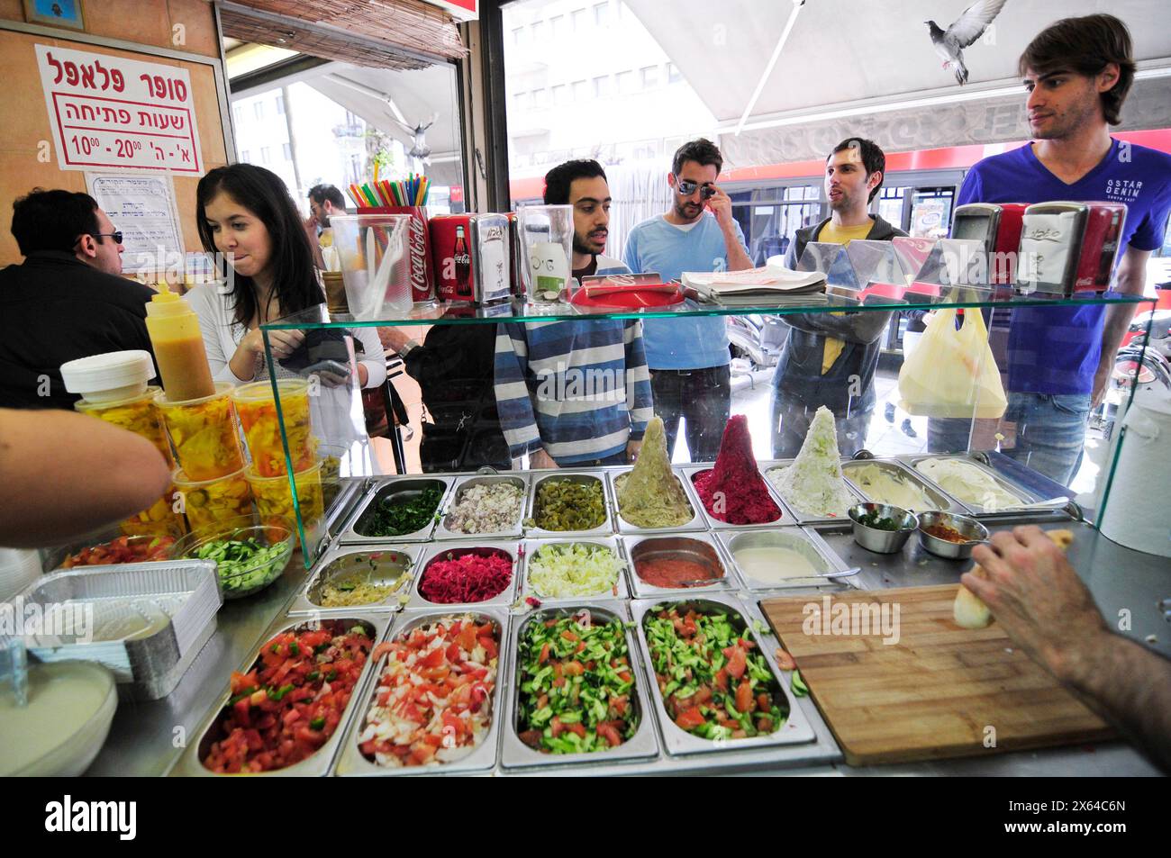 Preparing Falafel in PIta bread at the popular Super Falafel on Allenby ...