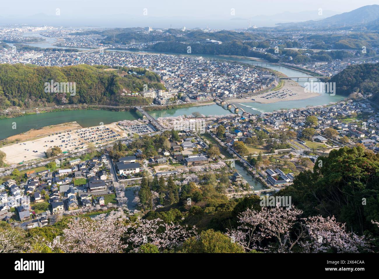 View of the Kintai Bridge and Kikko Park from above. Cherry blossoms along the Nishiki River ...