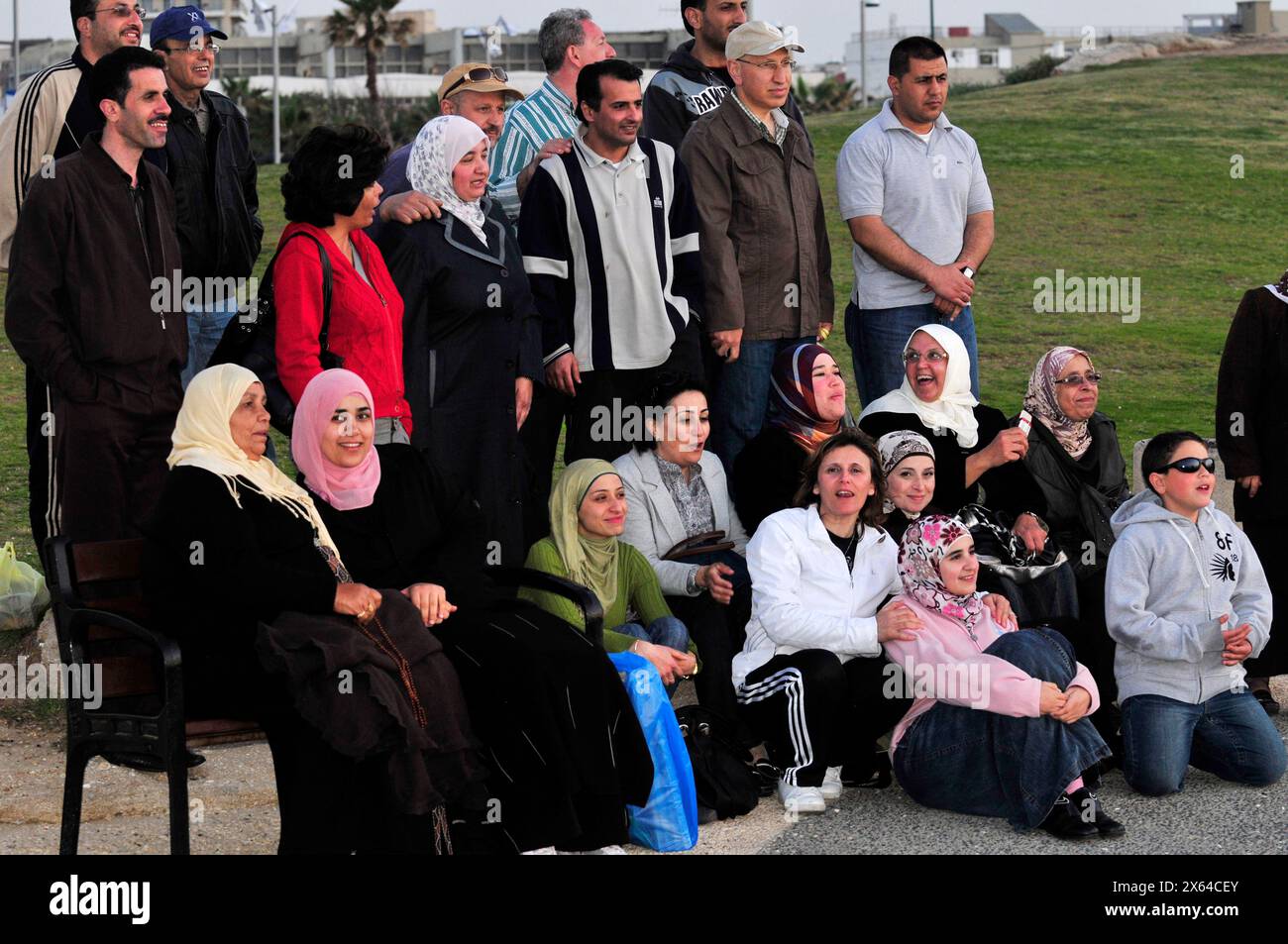 An Israeli Palestinian family poses for a group photo on the promenade ...