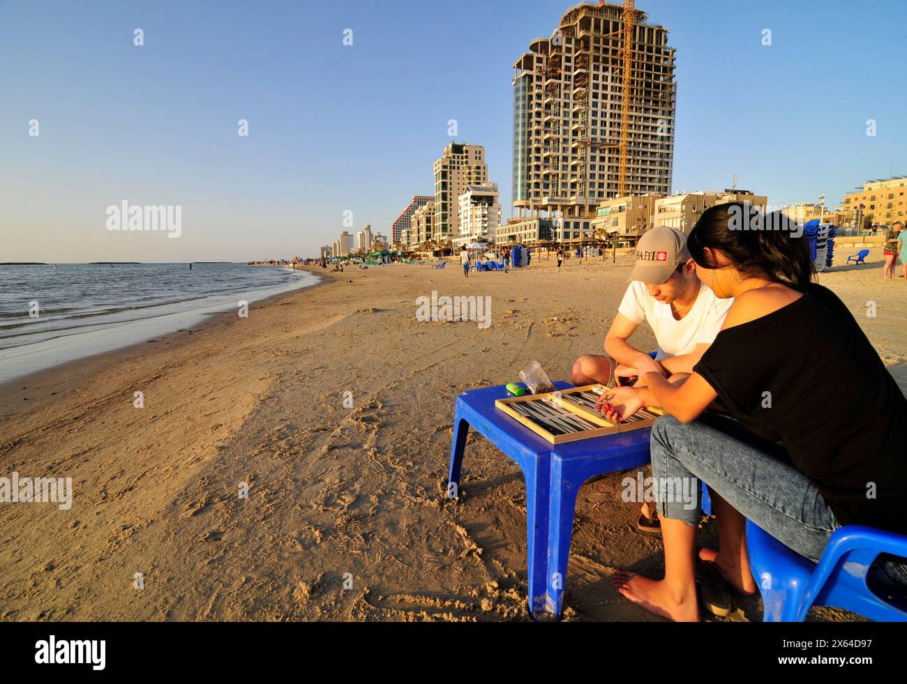 A couple playing backgammon on the beach in Tel-Aviv, Israel Stock ...