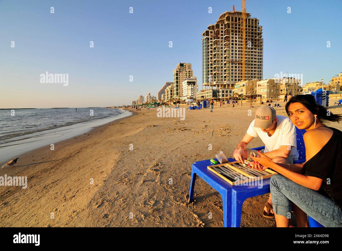 A couple playing backgammon on the beach in Tel-Aviv, Israel Stock ...