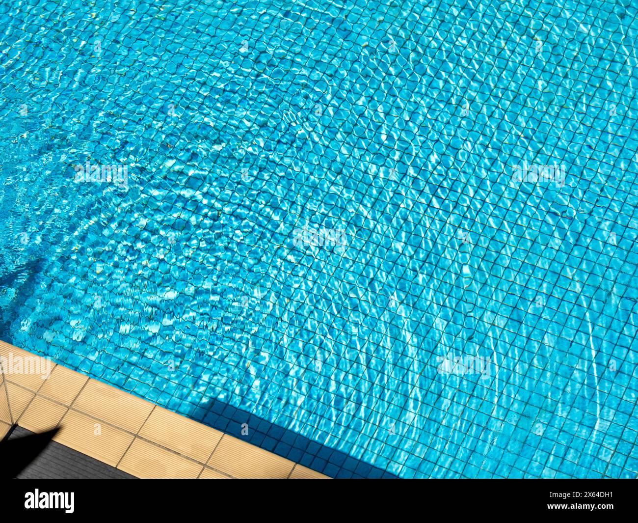 Top view space of blurred round rippled clear water moving on blue grid ...