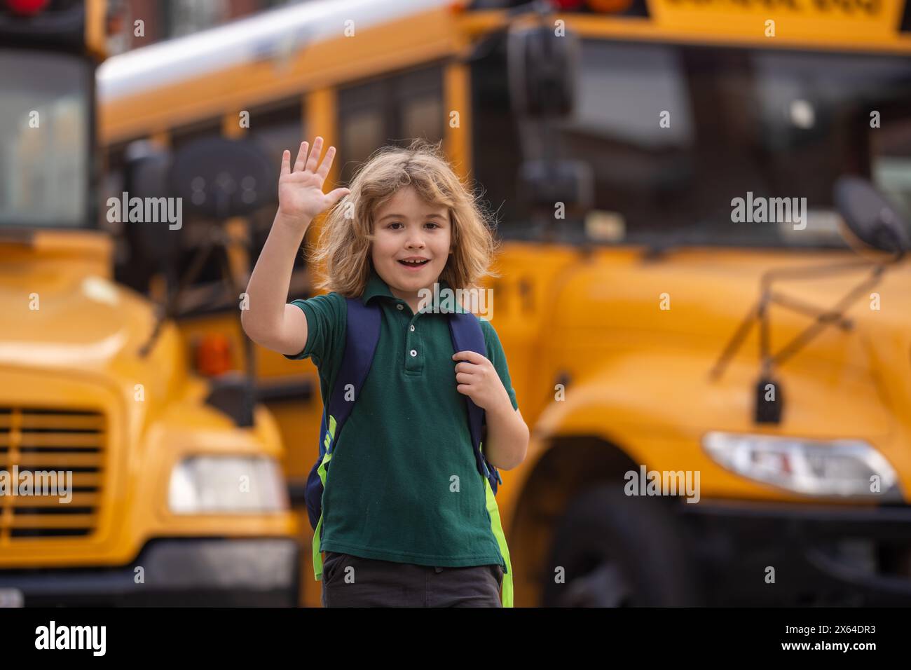 Pupil getting on the school bus. American School. Back to school. Kid ...