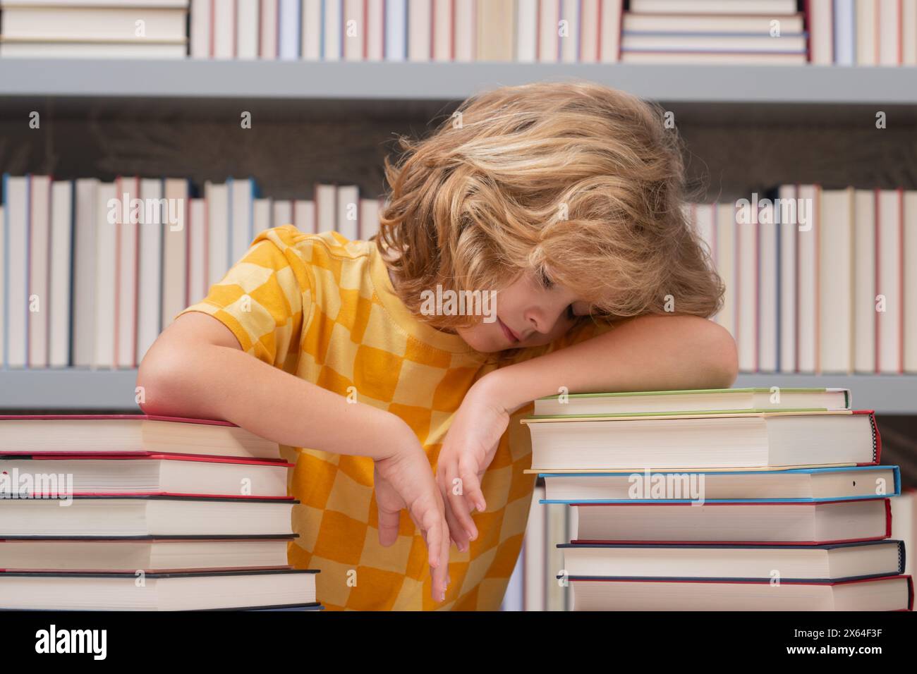 Tired school boy, bored pupil at school. Child not study read book in ...