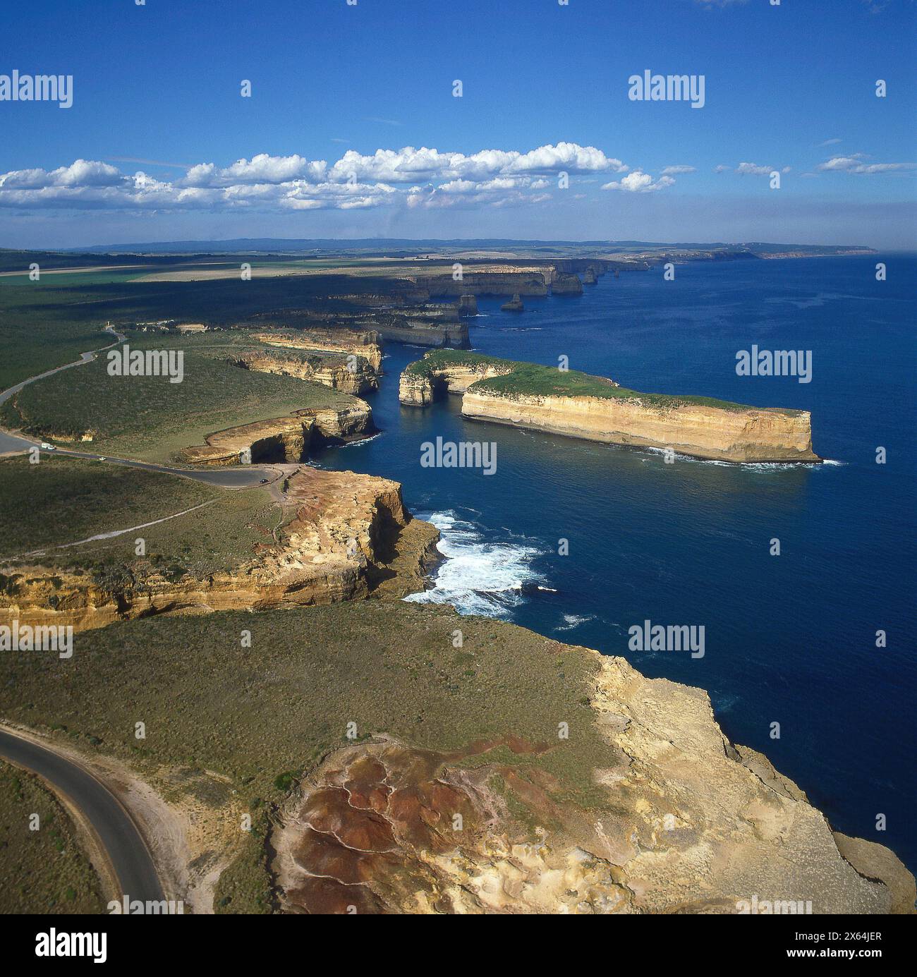 AERIAL OF THE GREAT OCEAN ROAD, VICTORIA, AUSTRALIA. THE ROAD IS THE ...