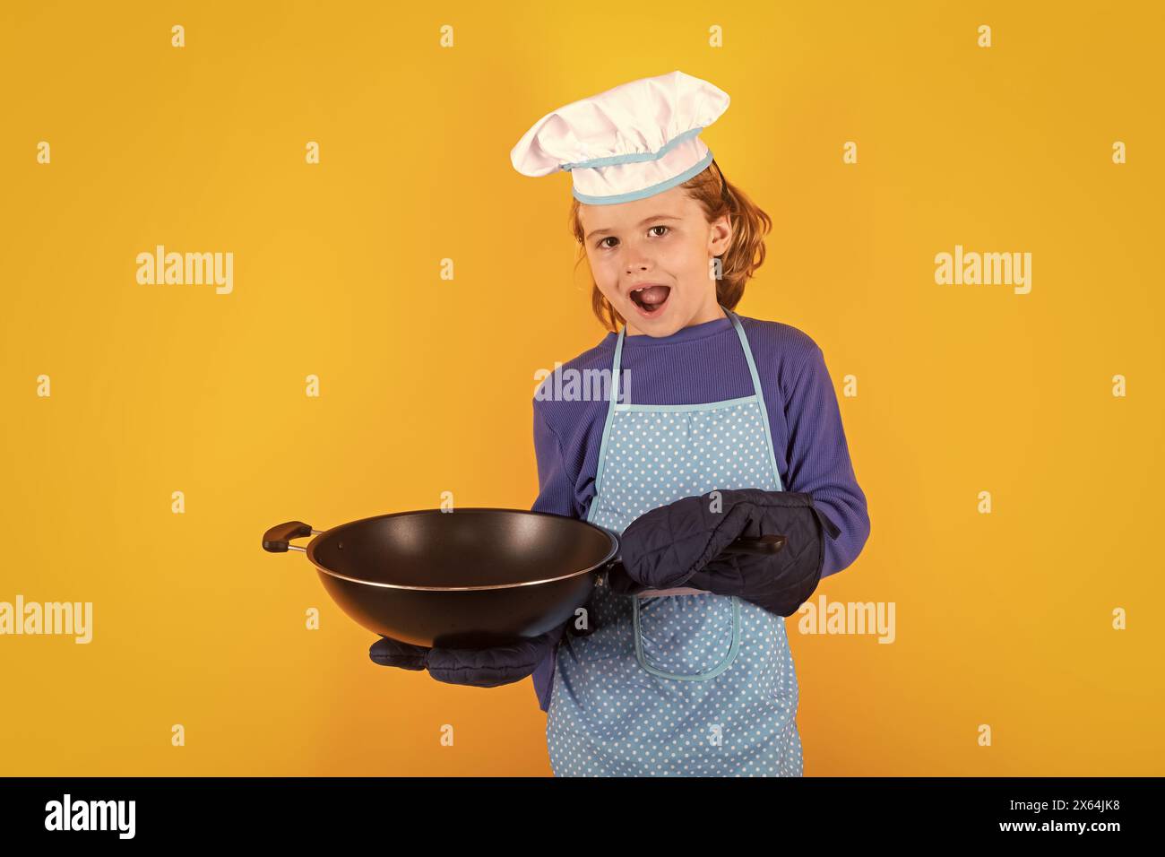 Child chef cook with cooking pan. Cooking children. Chef kid boy making ...