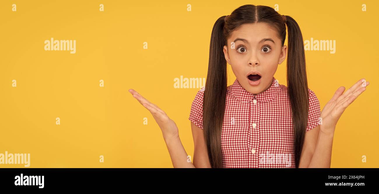OMG. Surprised child yellow background. Wide-eyed girl got surprised ...
