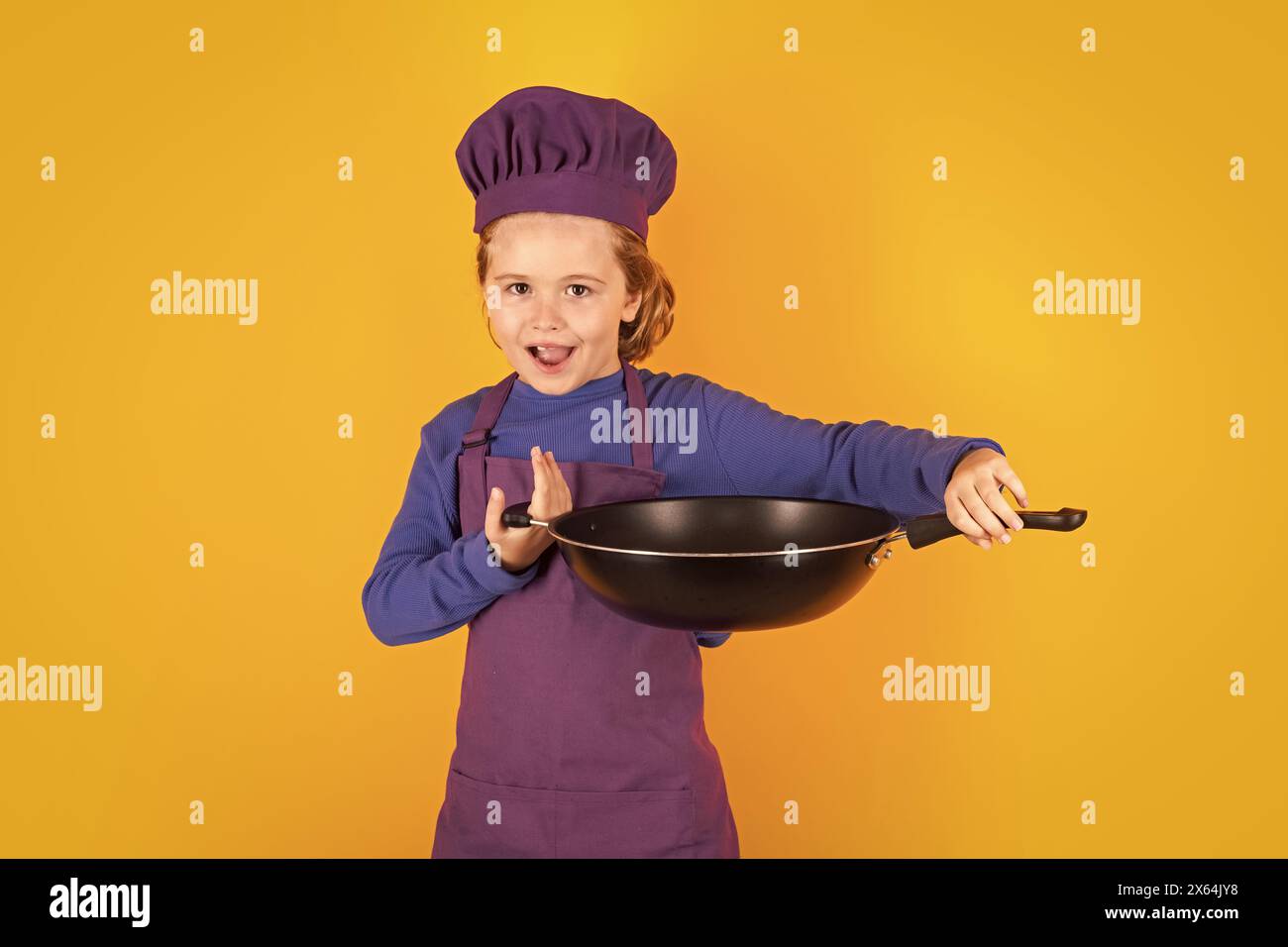 Kid boy chef cook with cooking pan. Chef child preparing healthy food ...