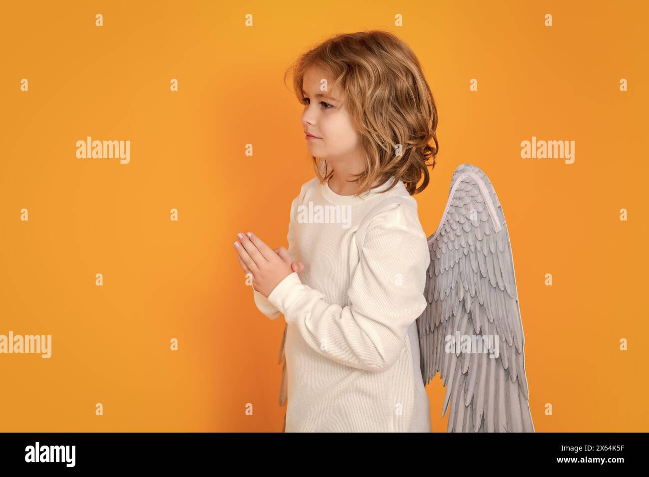 Angel prayer kids. Child at angel costume. Kid with angel wings ...