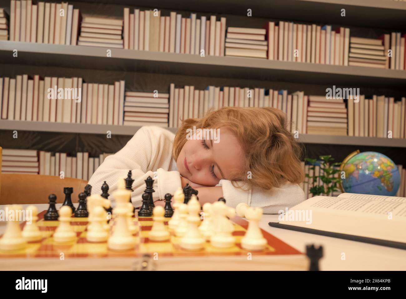 Boring school. Tired kid think about chess game. Sleepy lod feeling ...