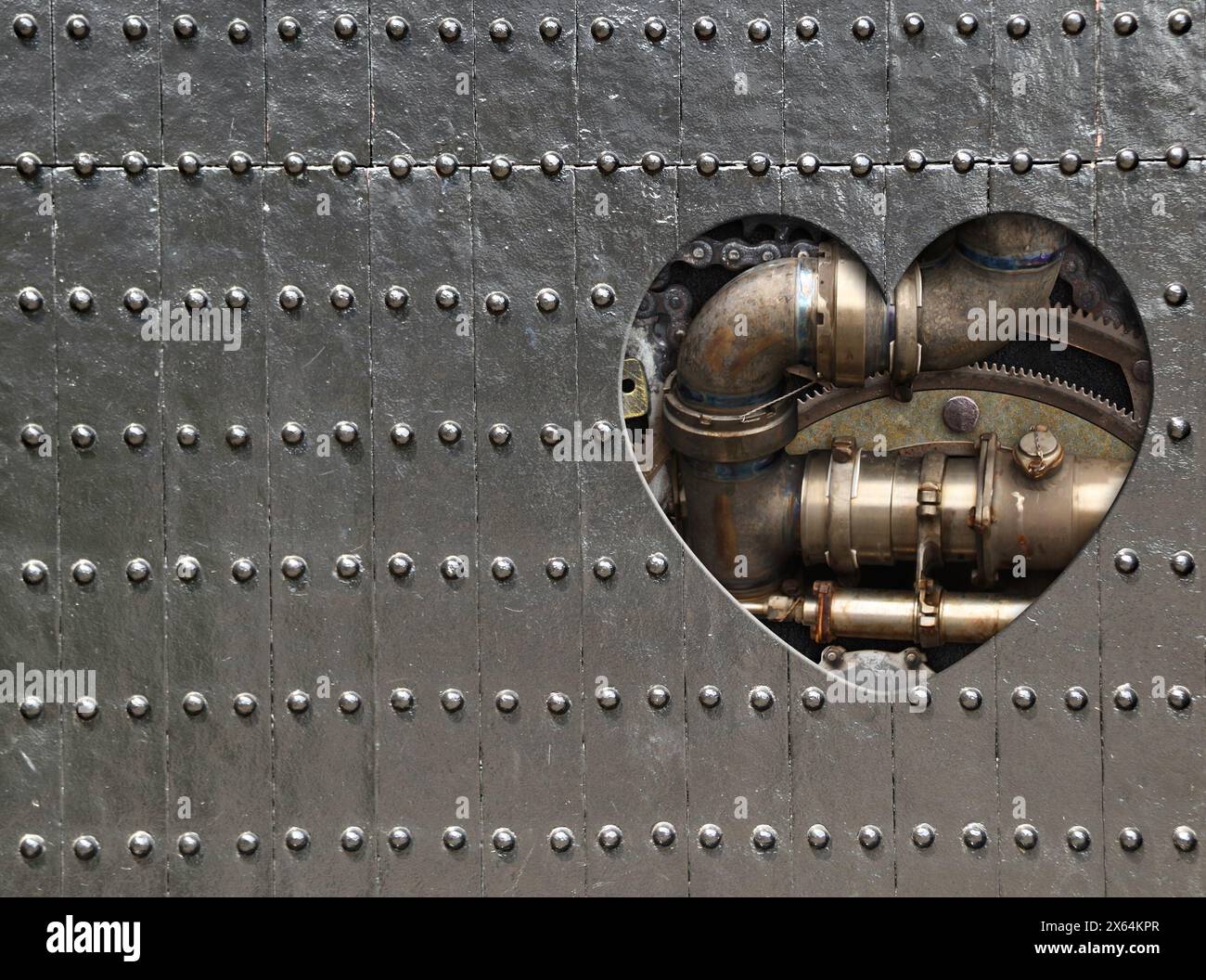 Retro background in steampunk style with heart-shaped hole in metal ...