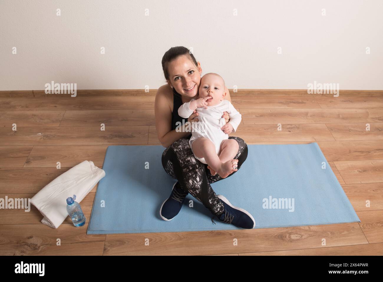 Home exercise for mother and baby, mommy and me workout. Physical ...