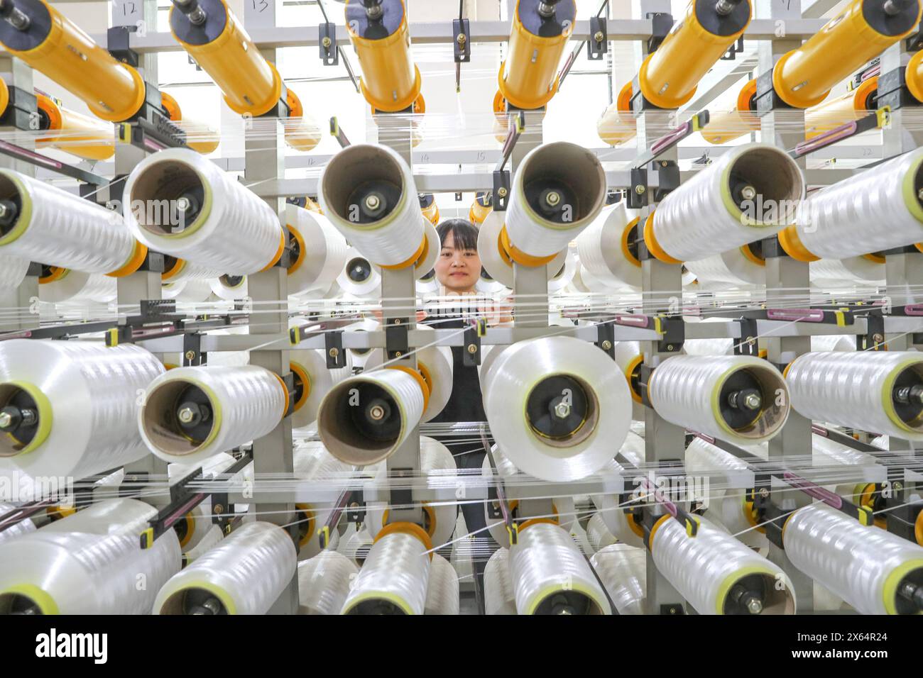 HUZHOU, CHINA - MAY 13, 2024 - A worker is producing bulletproof ...
