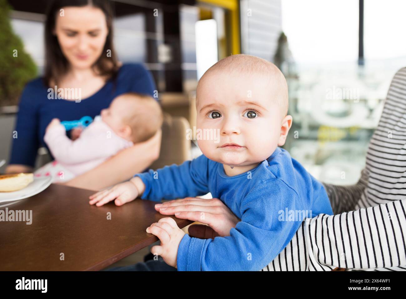 New mom friends going to cafe with babies. Spending free time during ...