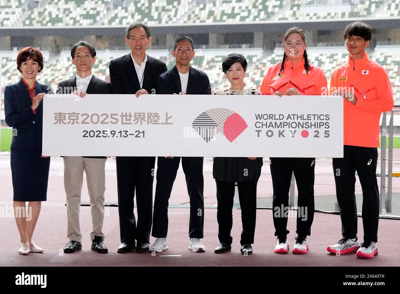 From left, former professional marathon runner Yuko Arimori, Masahiko Kimura, the logo design ...