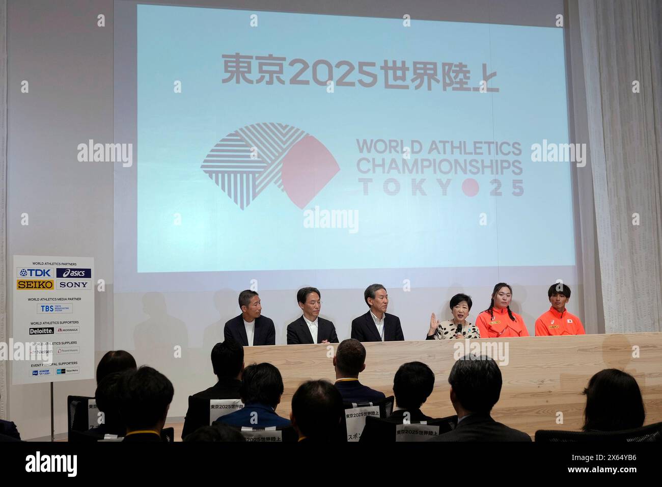 From left, Ryo Nakagawa, a designer of the selected logo, Masahiko Kimura, the logo design ...