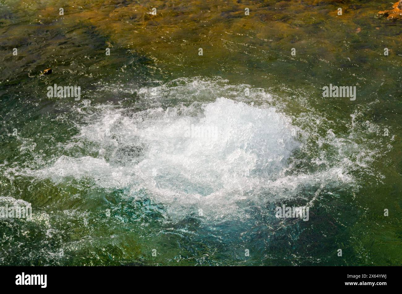 Hot water bubbling up in one of the pools at Terrace Springs thermal feature. Yellowstone ...