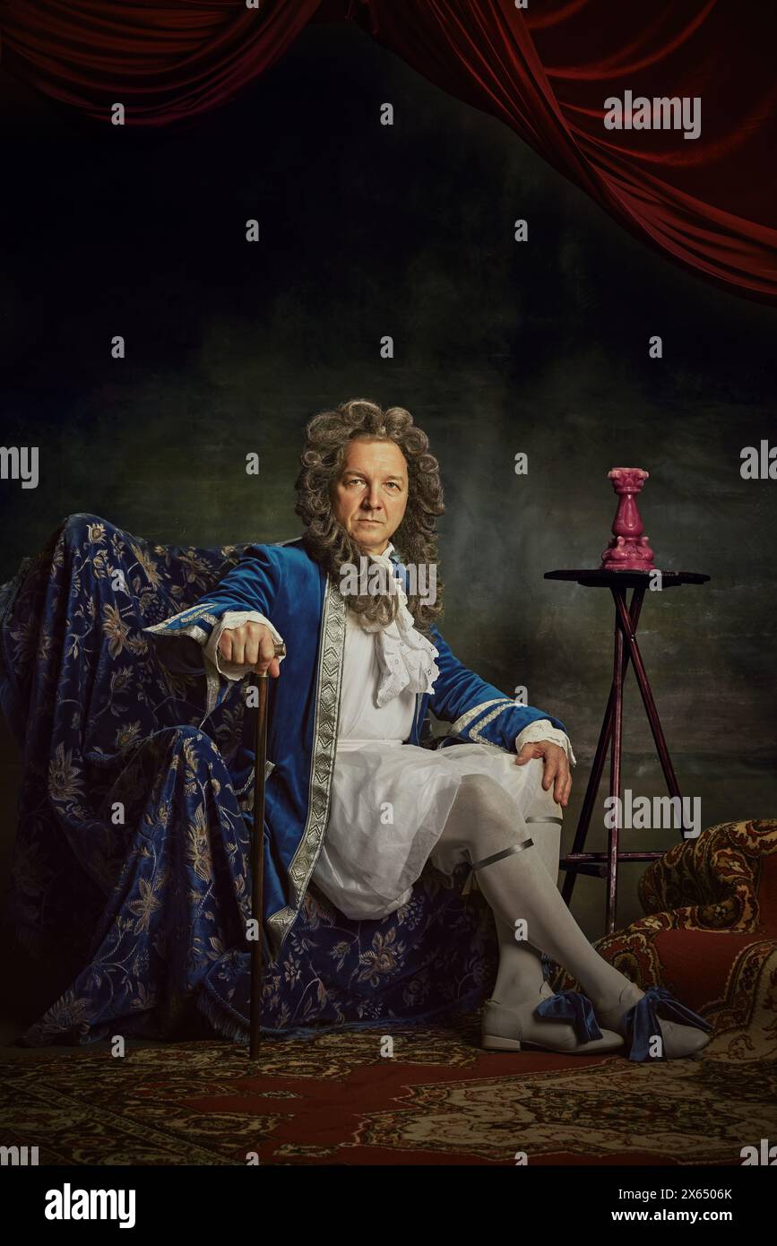 Portrait of elderly man dressed in elaborate baroque-style attire ...