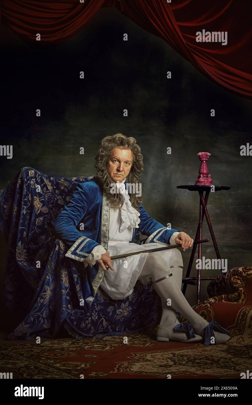 Portrait of elderly man, looks as medieval person, aristocrat, sitting ...