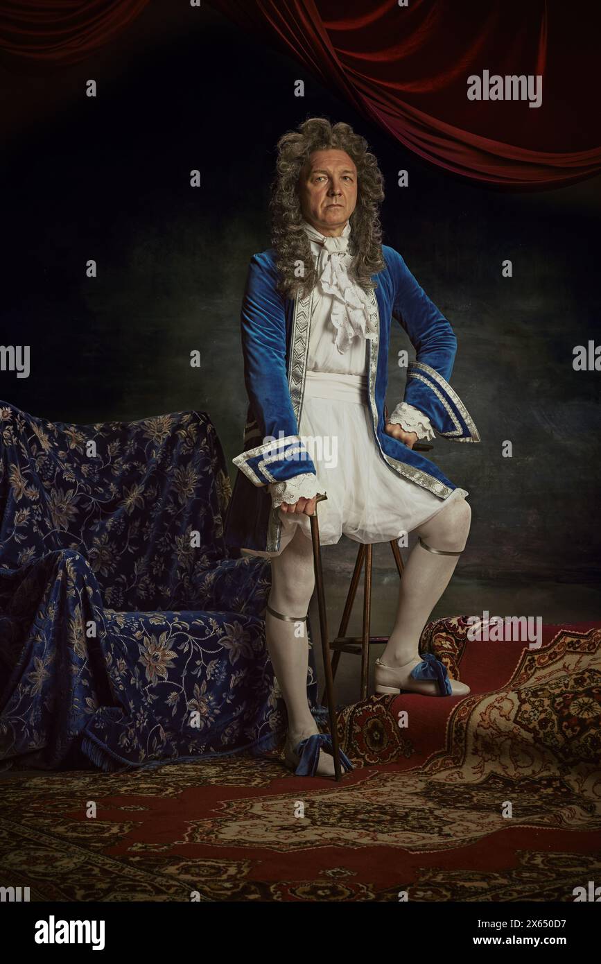 Portrait of elderly man dressed as medieval person, aristocrat with ...