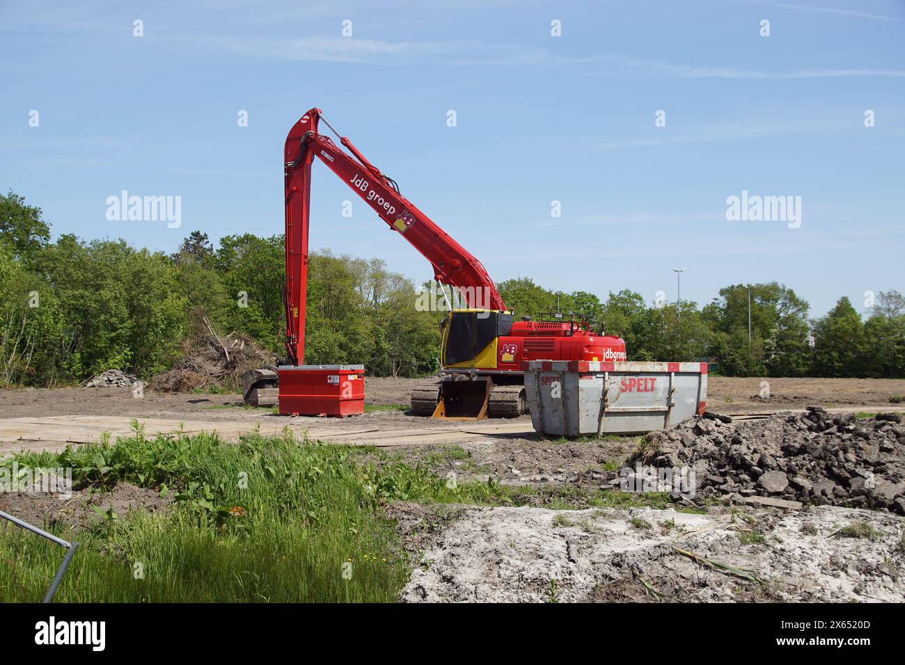 An excavator of the JdB groep, a Dutch civil engineering company ...