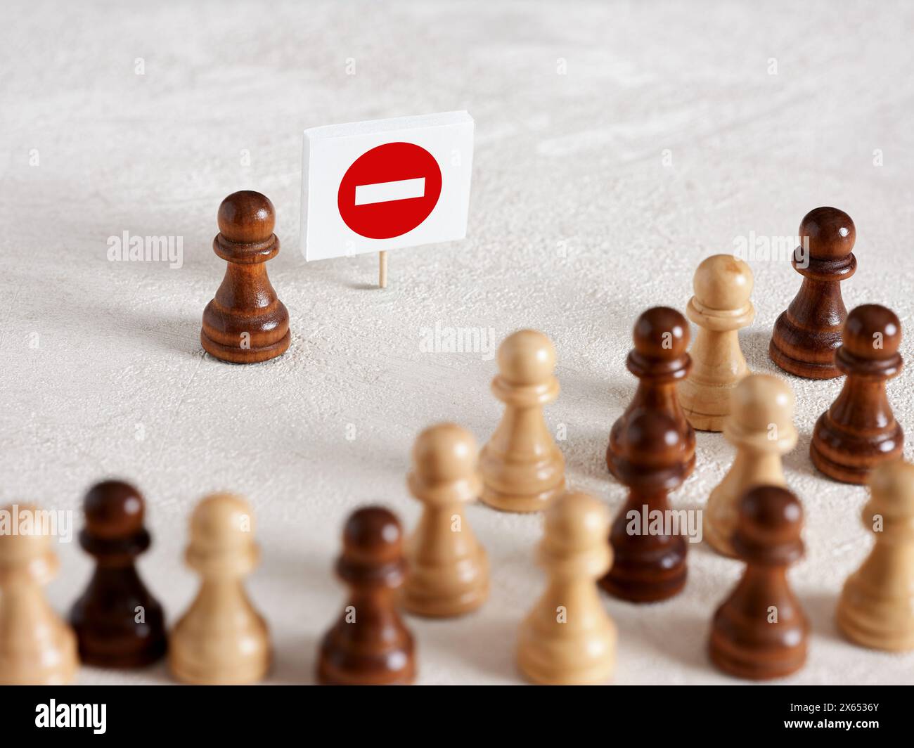 Chess pawn standing next to the banner with no entry sign. Prohibitions ...