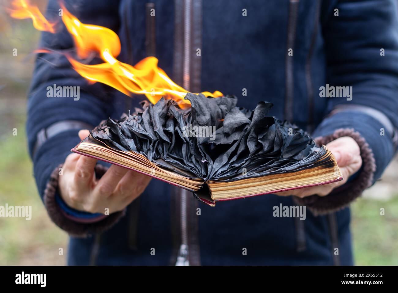 Burning book in hands hi-res stock photography and images - Alamy