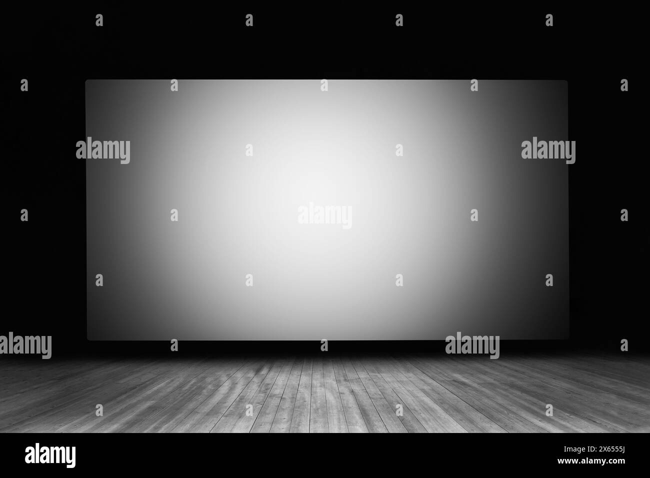 an empty white screen on a wooden stage in a movie theater black white ...