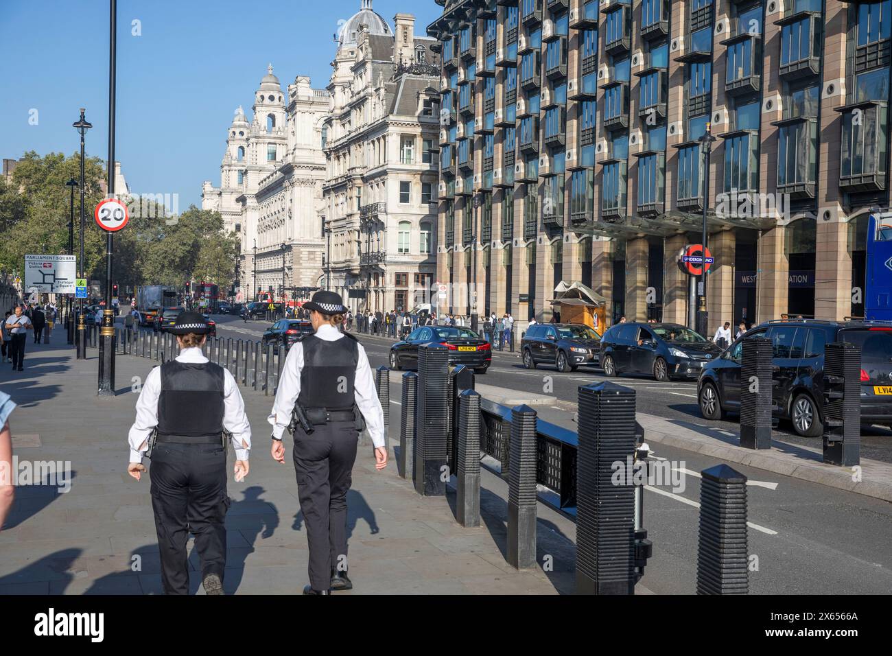 Female Metropolitan police women on foot patrol opposite Portcullis ...