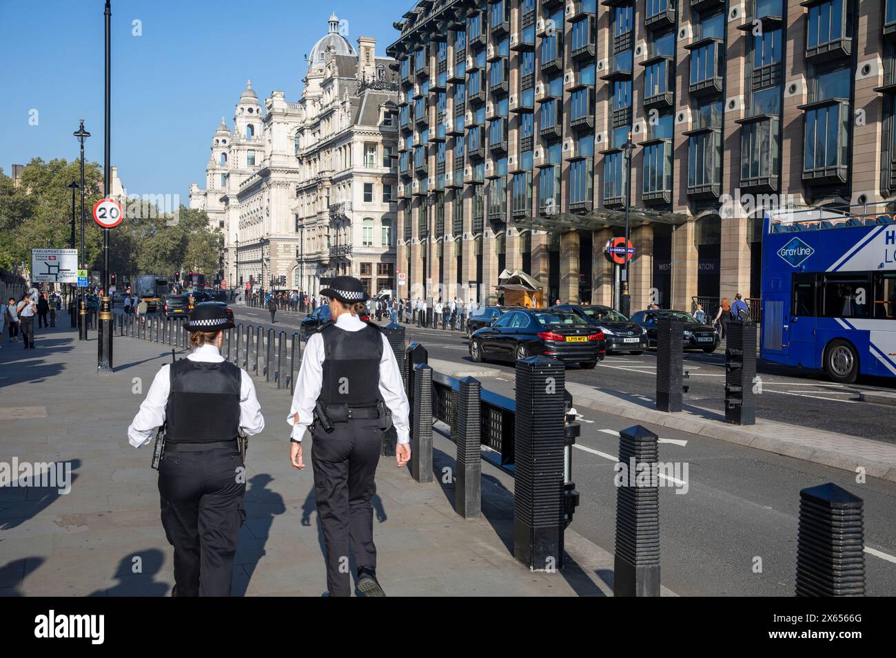 Female Metropolitan police women on foot patrol opposite Portcullis ...