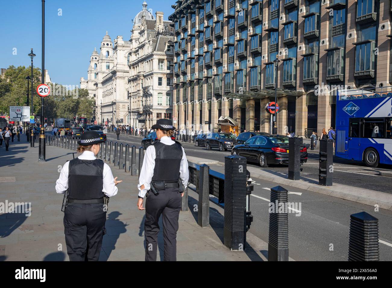 Female Metropolitan police women on foot patrol opposite Portcullis ...