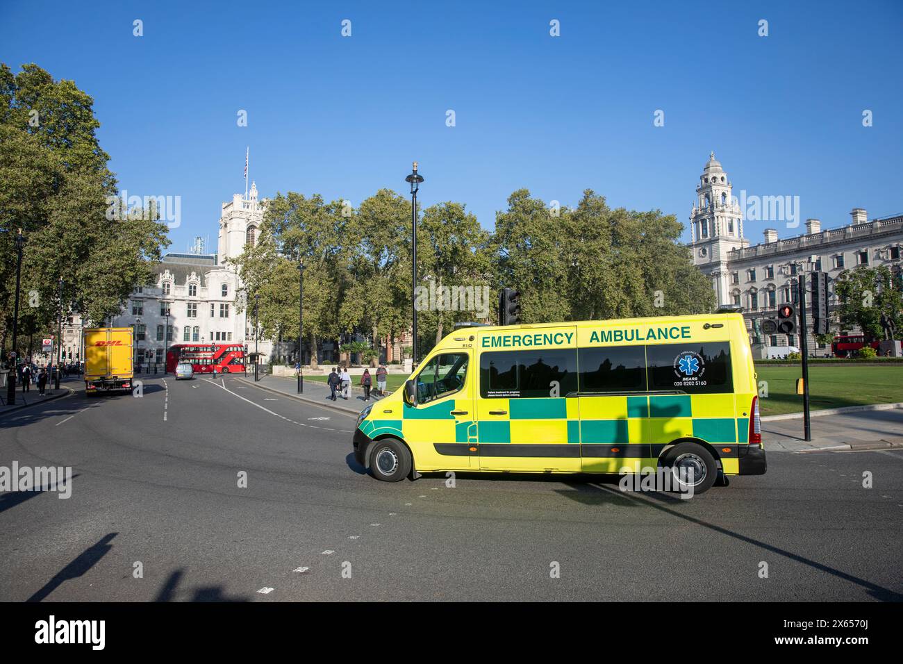 London, NHS ambulance travelling around Parliament Square in ...