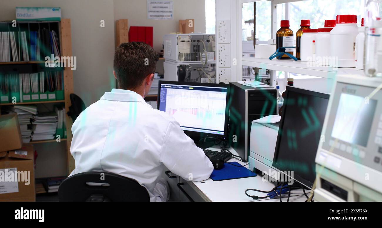 Image of chemical formulas and data processing over back of caucasian ...