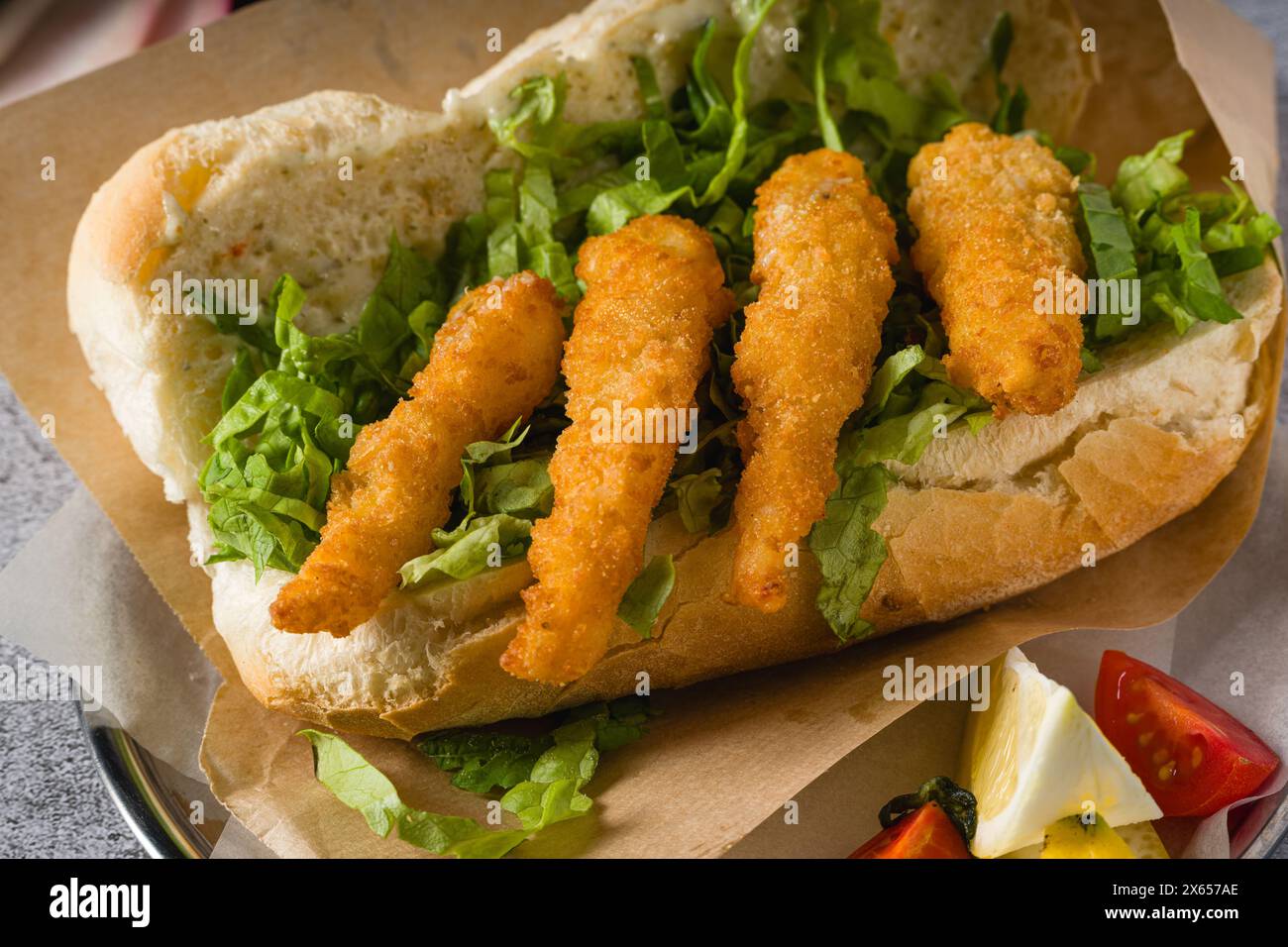 Deep fried shrimp in bread with greens on the side. Shrimp sandwich ...