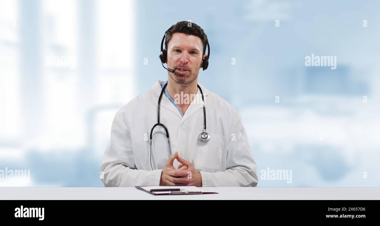 Image of caucasian male doctor on image consultation wearing phone ...