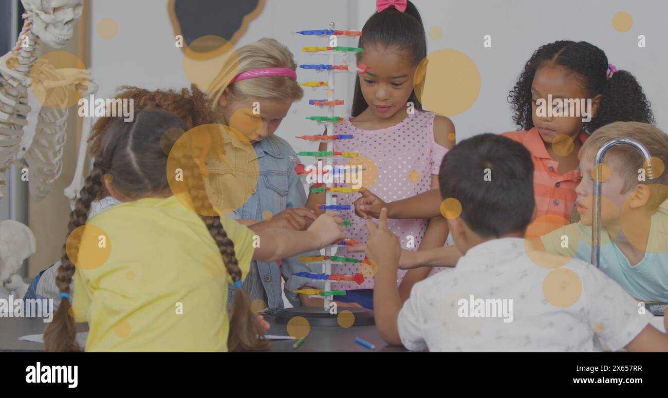 Image of yellow spots over diverse school children in classroom Stock ...