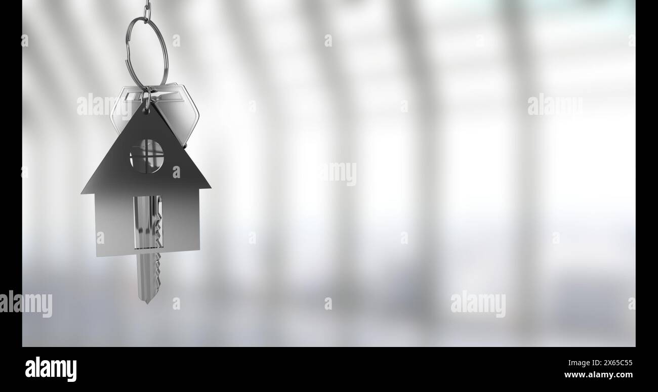 Image of silver house keys hanging against blurred background with copy ...