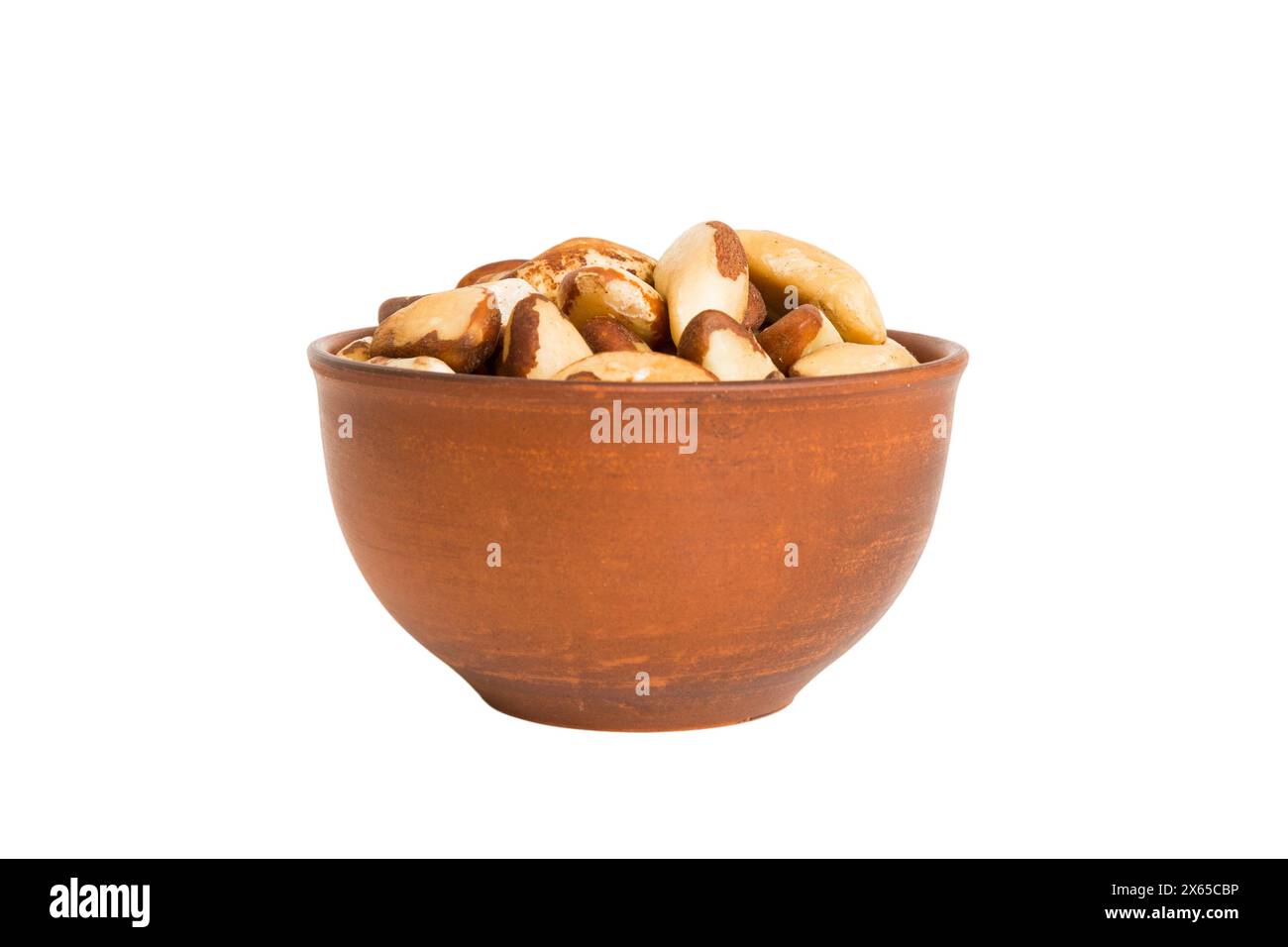 Roasted Brazil nut in bowl isolated on white background. Brazil nut is ...