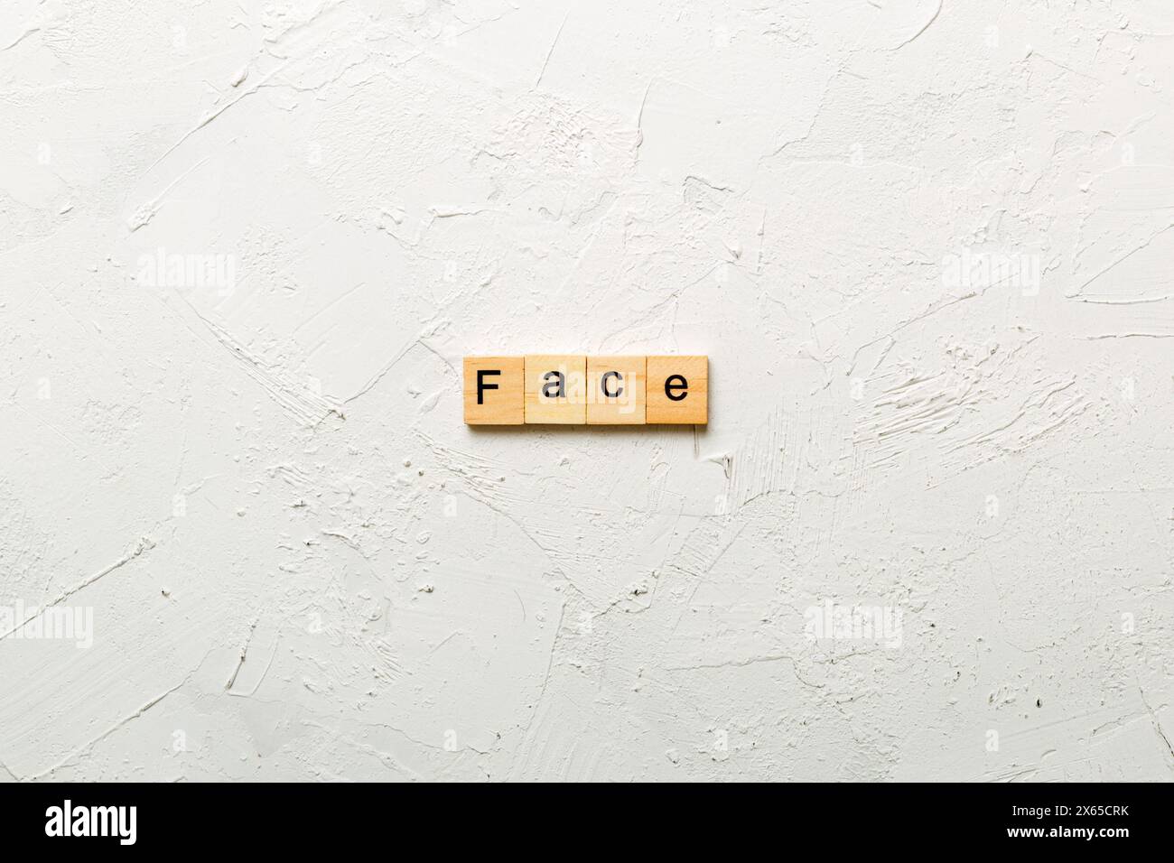 Fake word written on wood block. Fake text on cement table for your ...