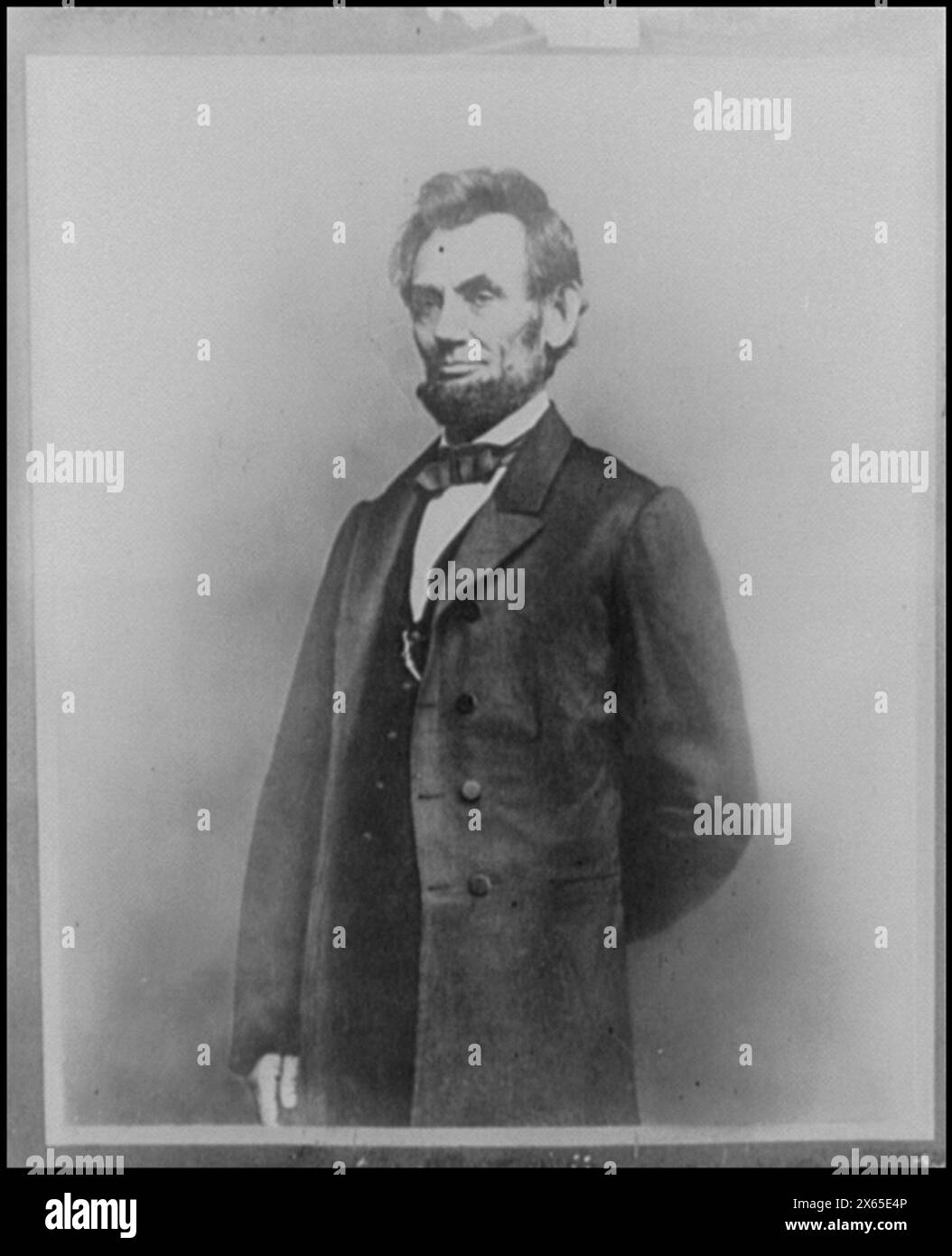 Abraham Lincoln, three-quarter length portrait, standing, facing left ...