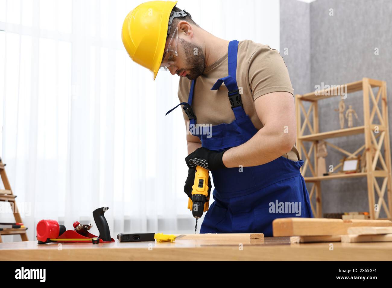 Industrial young carpenter worker using hi-res stock photography and ...