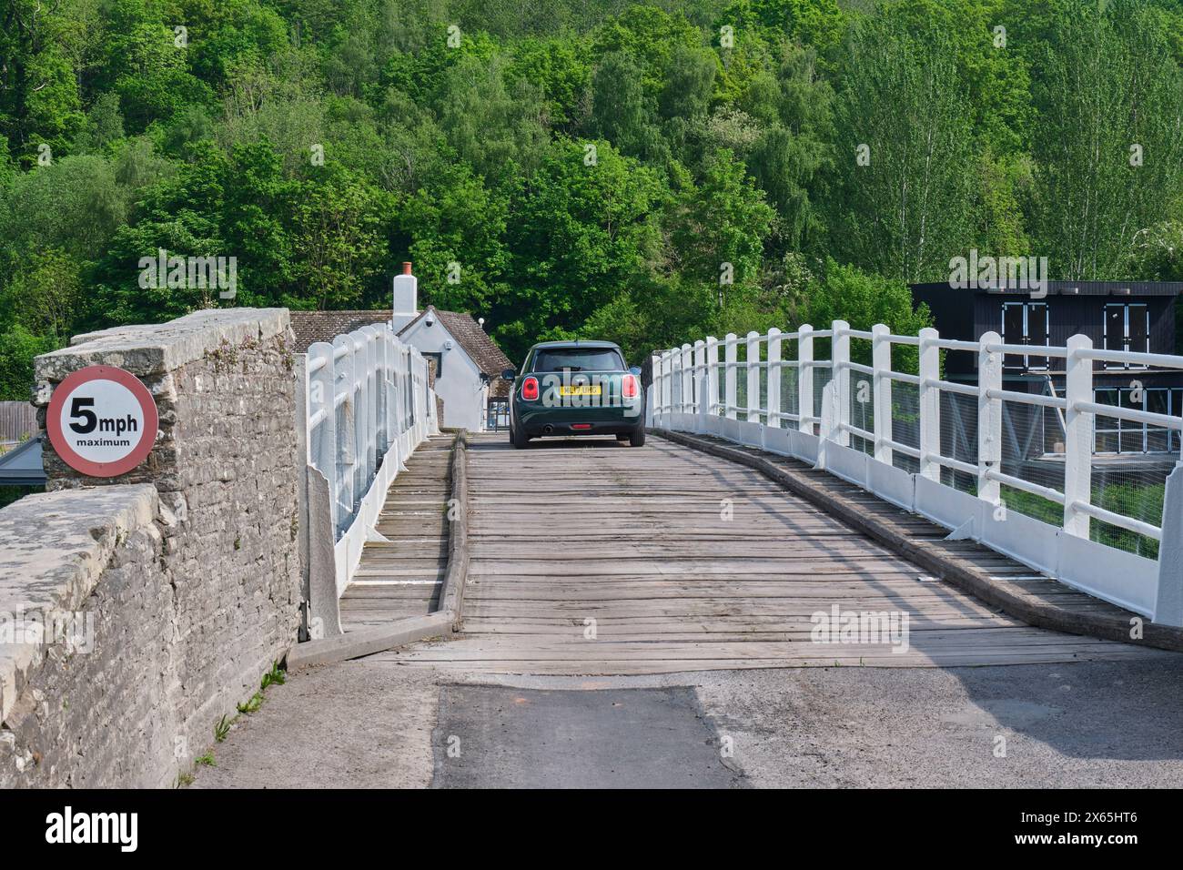 Car crossing the toll bridge at Whitney-on-Wye, across the River Wye ...