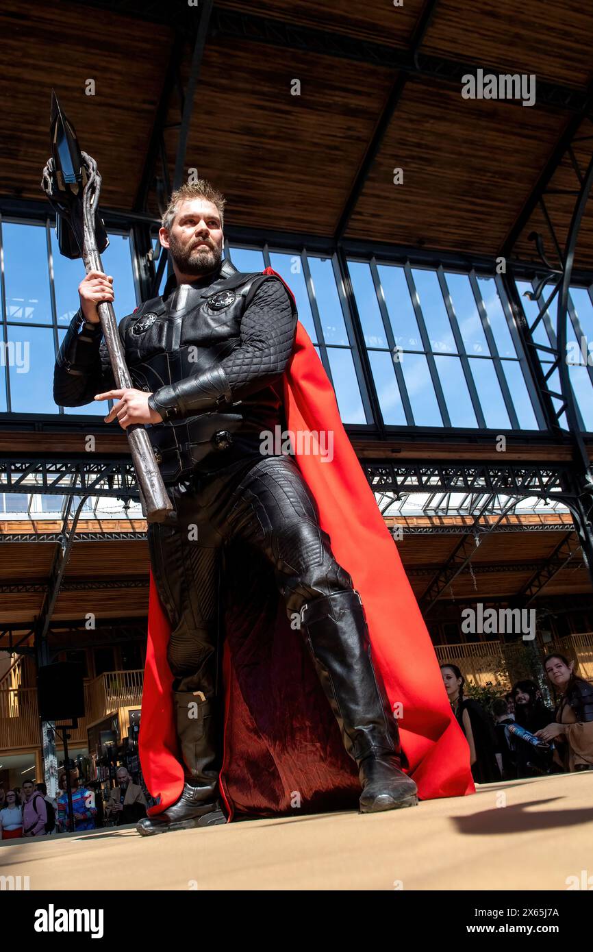 A Cosplayer dressed as Thor from the MCU on the runway at Comic Con ...