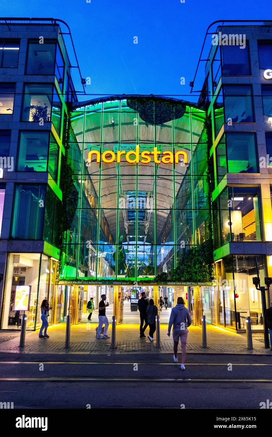 Illuminated entrance to the Nordstan Shopping Centre at night ...
