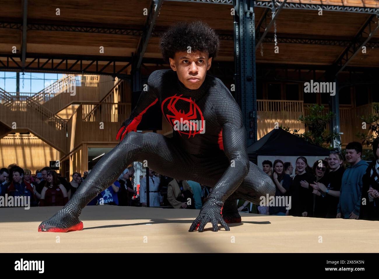 A Cosplayer dressed as Miles Morales from Spider-Man: Across the Spider ...