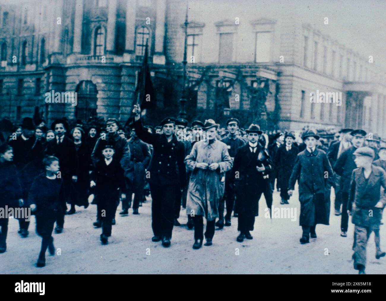 German sailor leading the revolutionary march with the red flag, Berlin ...