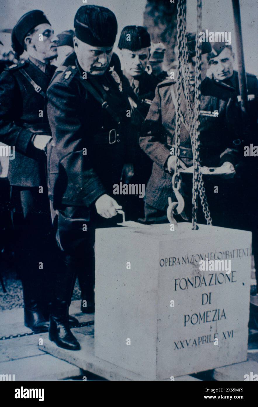 Italian dictator Benito Mussolini placing the first stone in Pomezia ...