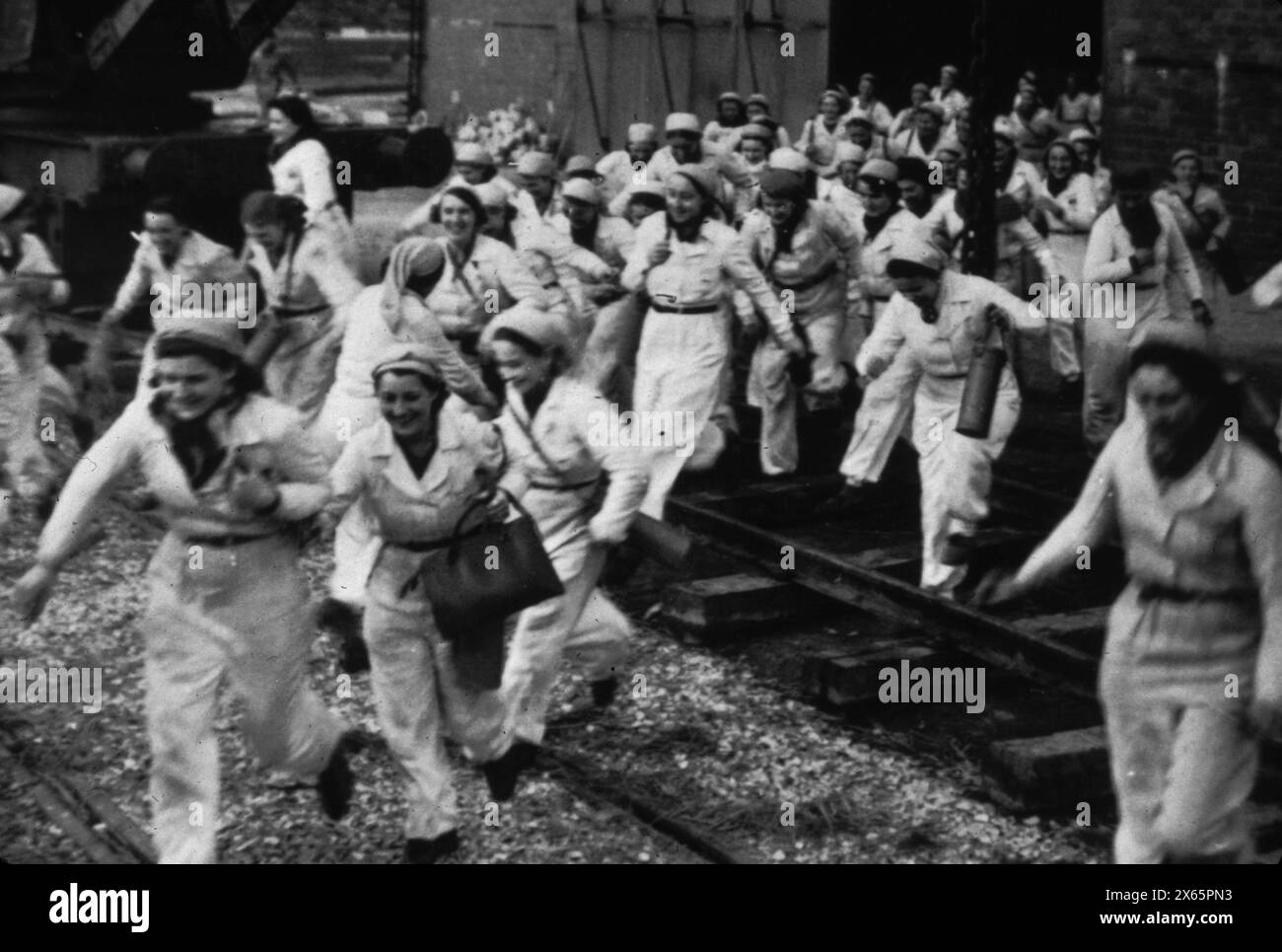 French women workers leaving the factory at the end of the shift ...